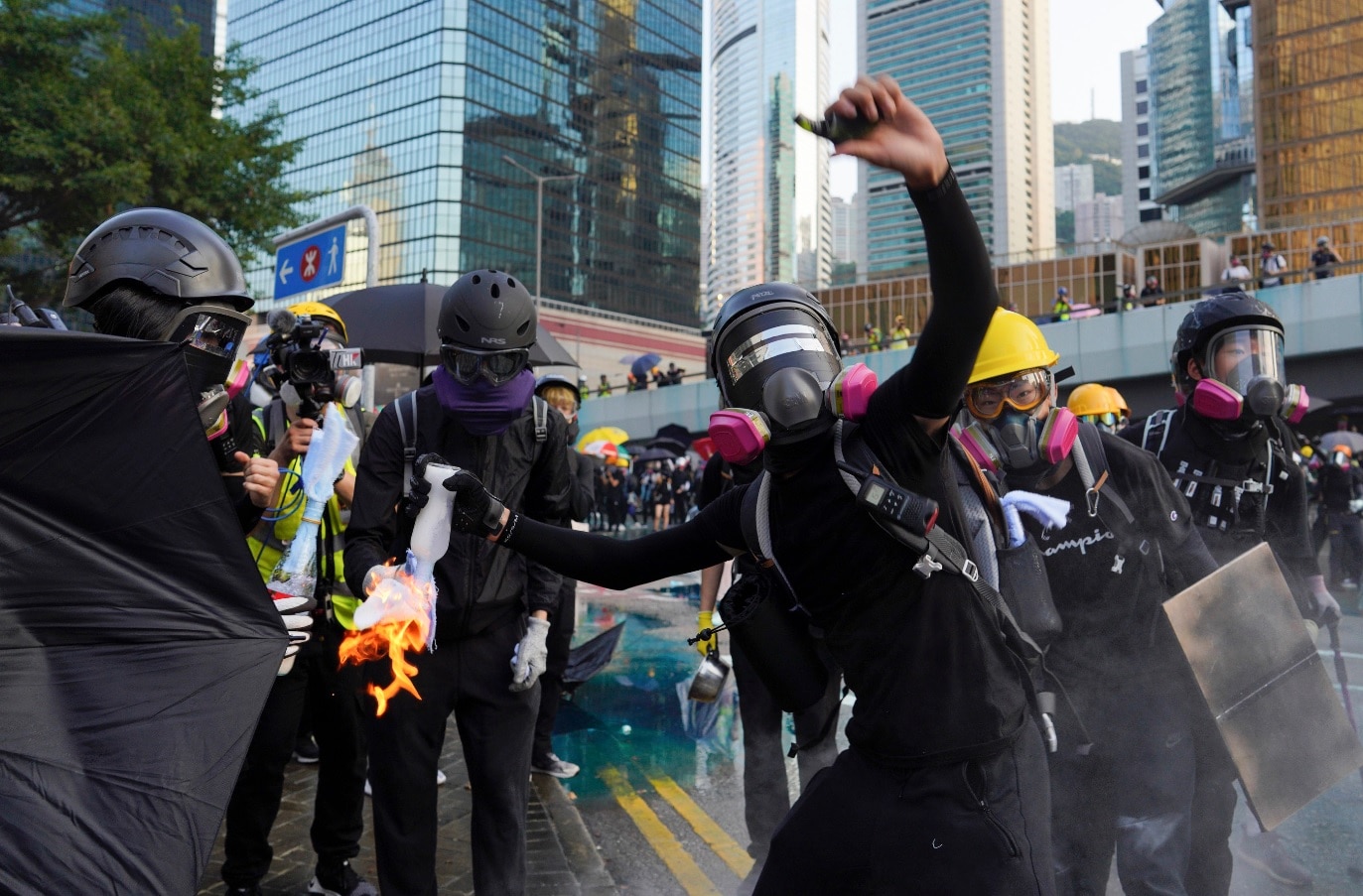 Hong Kong police fire water cannons and tear gas at protesters as ...
